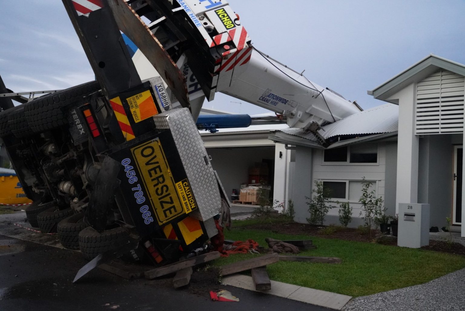 Crane topples and crushes homes in Aura