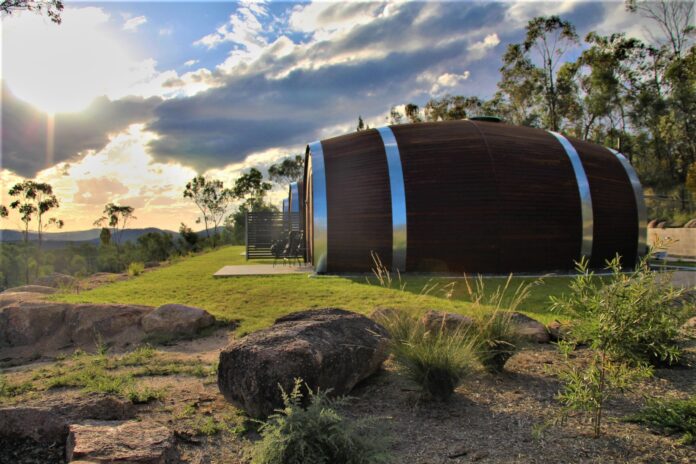 Drink in the view from luxury wine barrel cabins