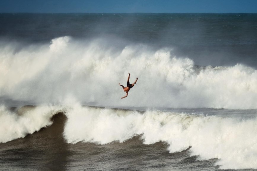 Surfing ace gets airborne as cyclone swell rolls in